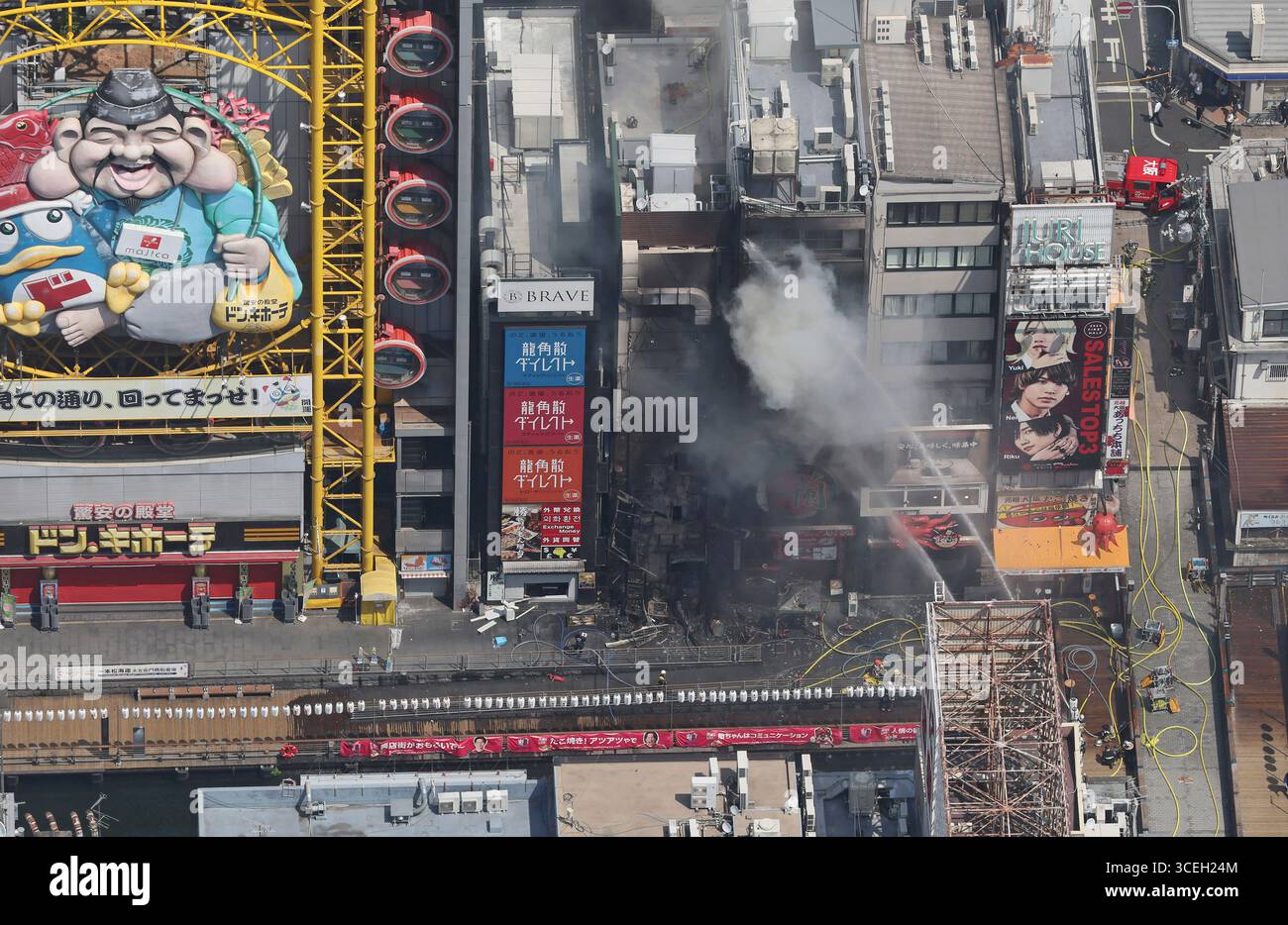 [DATE CORRECTION]An aerial photo shows firefighters conduct an ...