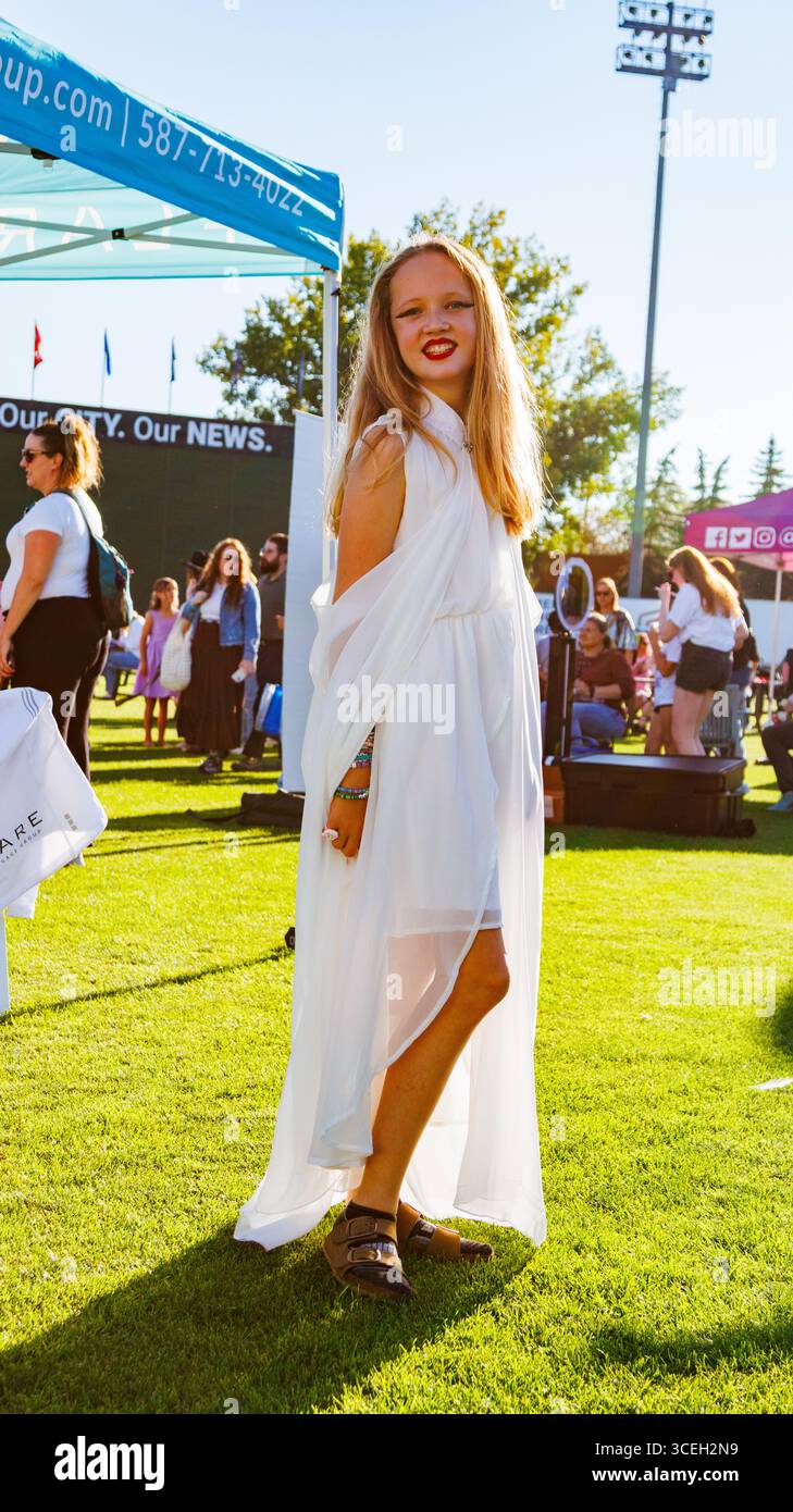 Dressed in a white evening dress and shawl similar to her favorite ...