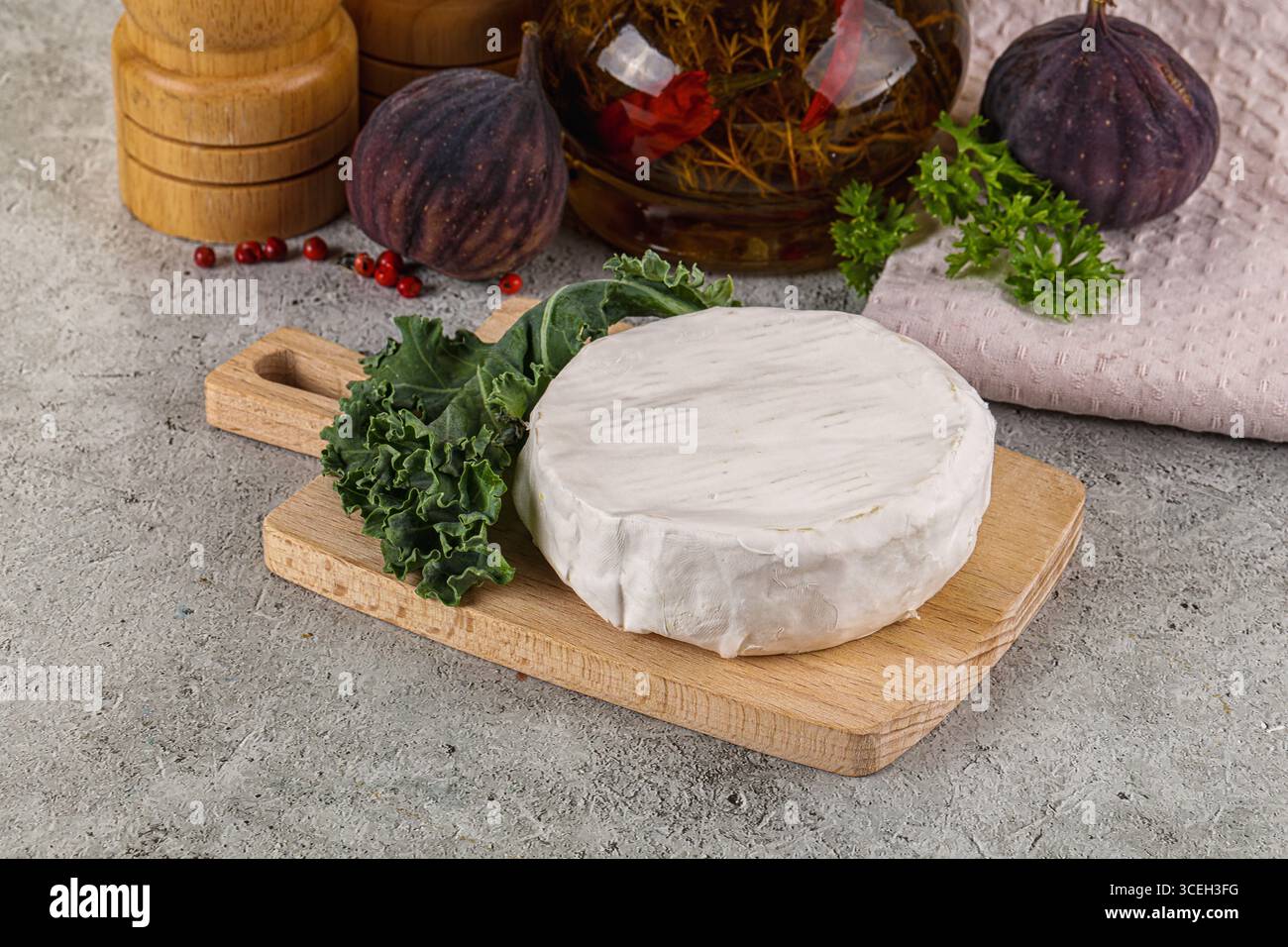 Gourmet round creamy Camembert cheese served fig Stock Photo - Alamy