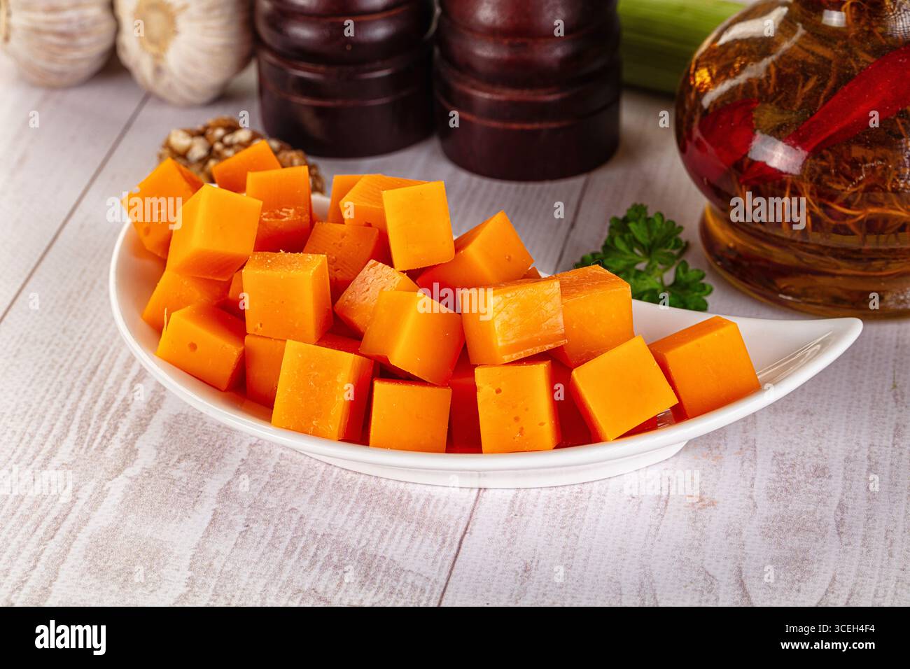 Yellow cheddae cheese cubes snack in the bowl Stock Photo - Alamy