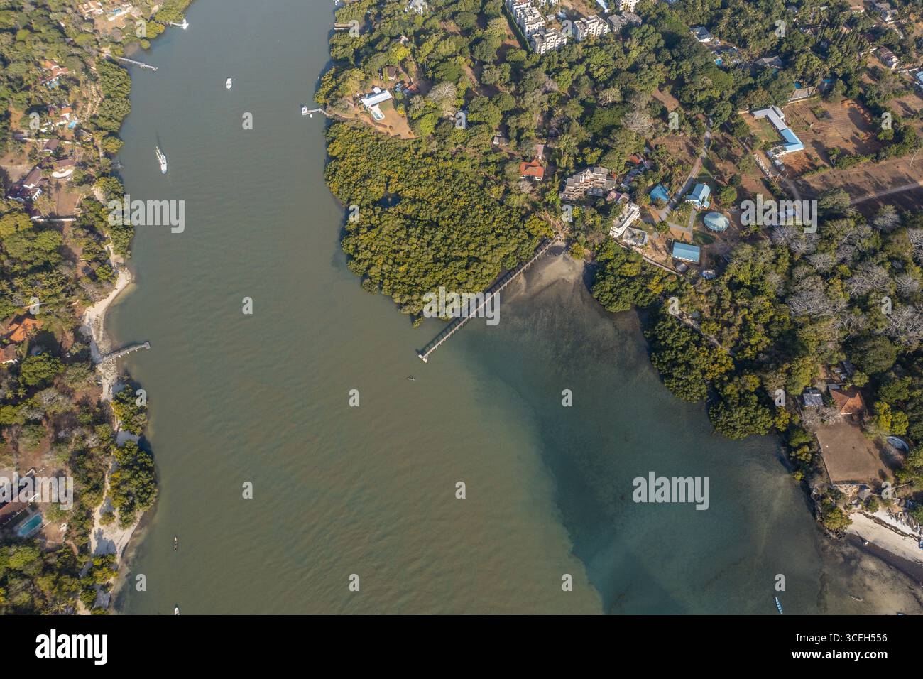 Aerial view of Mtwapa Creek's tranquil waters reflecting the sky ...