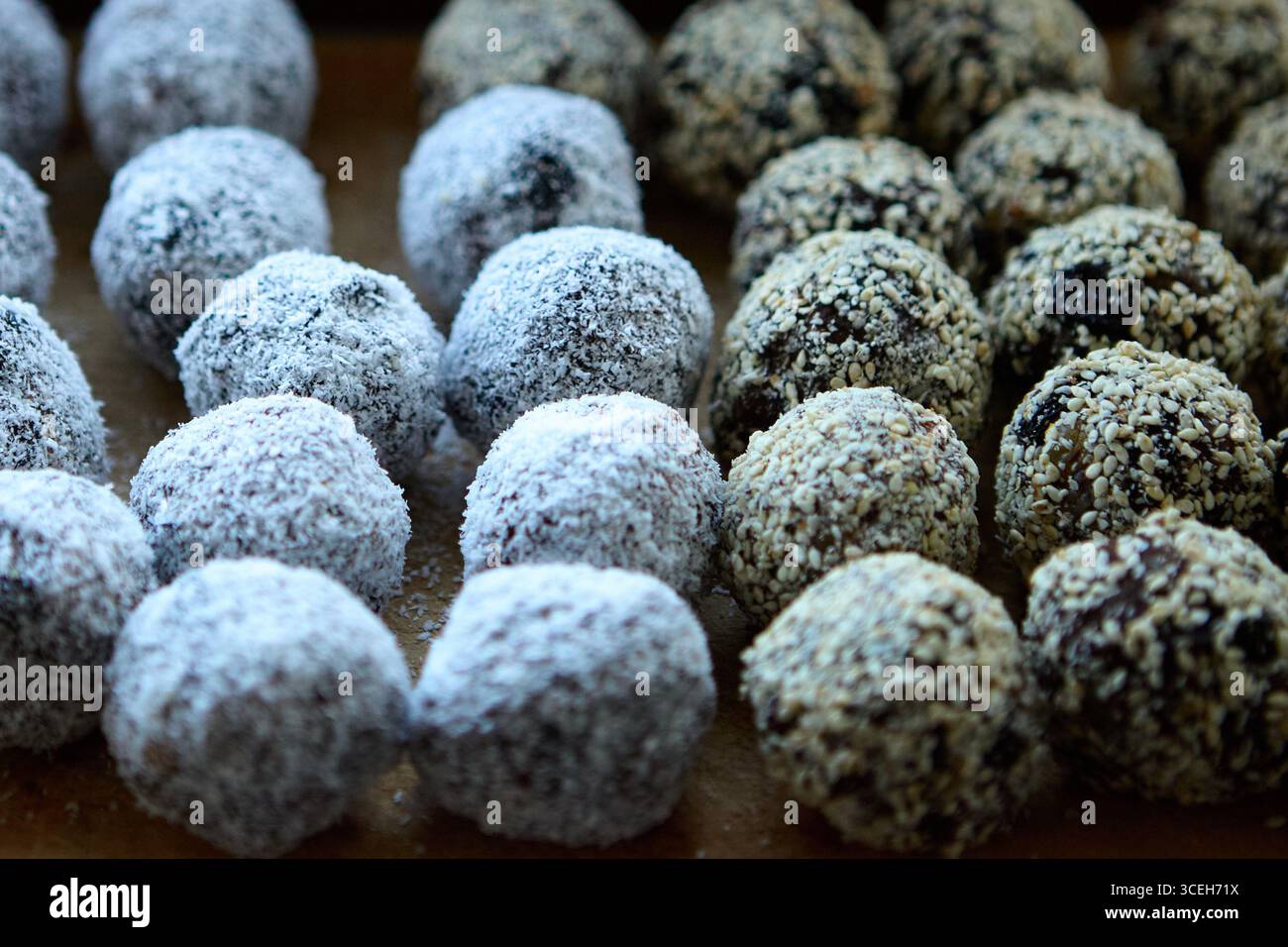 Healthy vegan energy sweets made from dates, nuts, raisins and cocoa ...