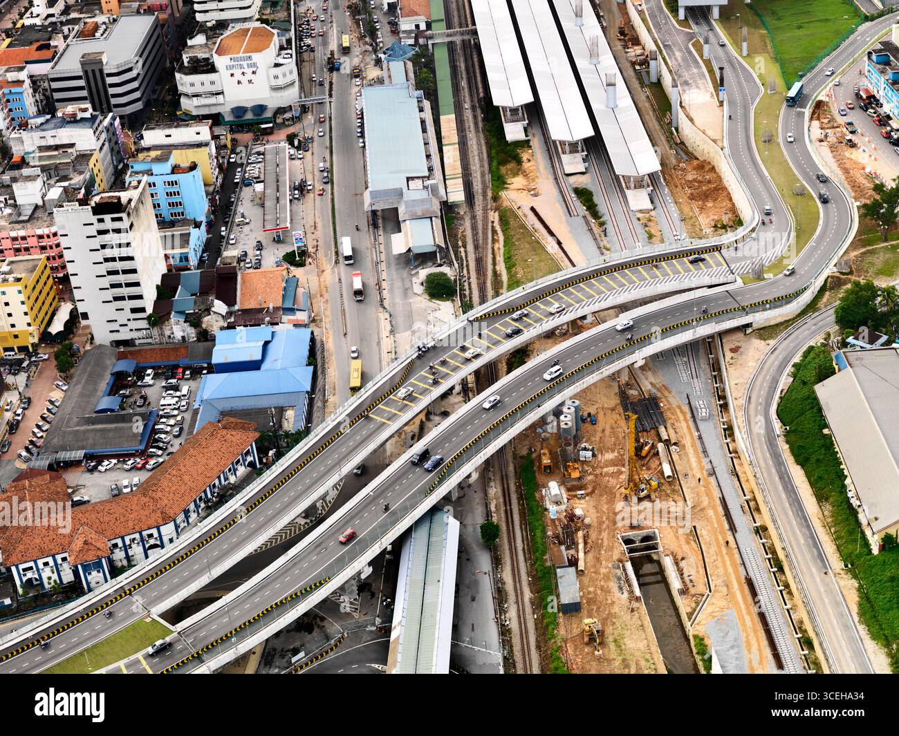 An aerial view of paraelle highways passing over the construction site ...