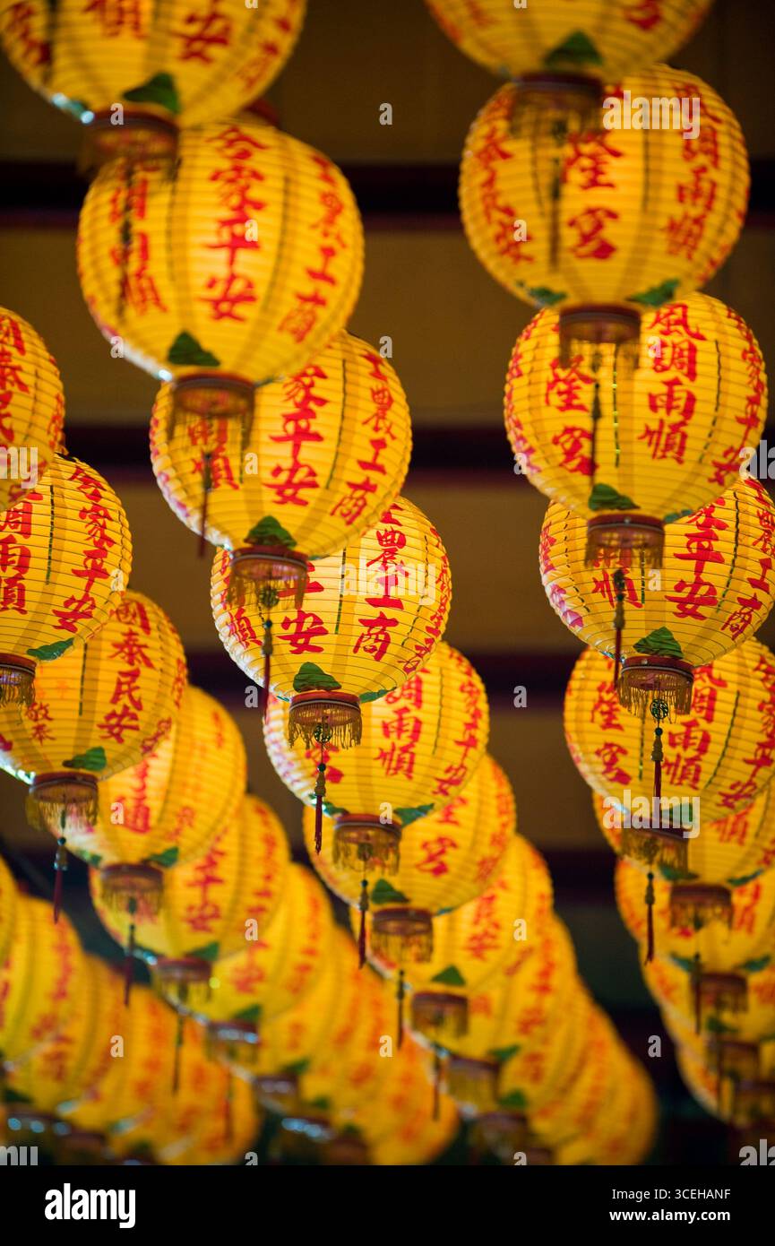 Yellow Chinese Lanterns hanging from the ceiling of a Daoist temple in ...