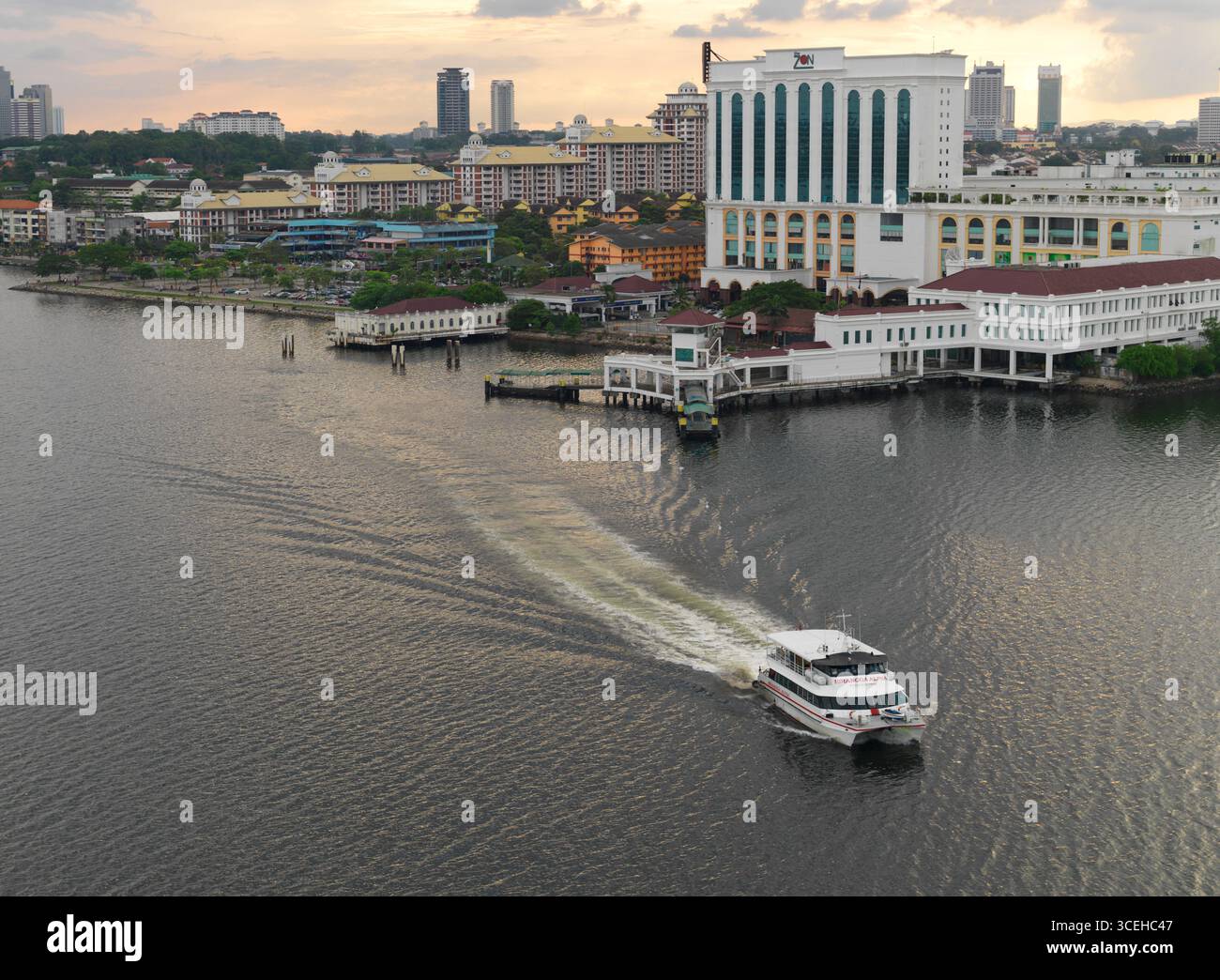 Aerial image of a ferry boat crossing the strait between Malaysia and ...