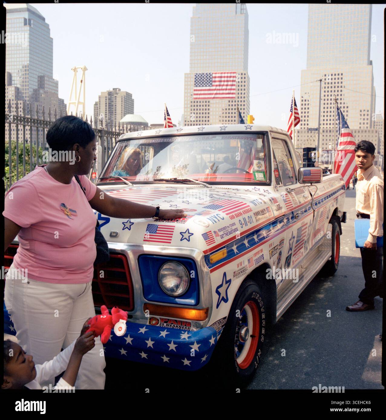New York, NY - September 11, 2003: Passers-by on the perimeter of the ...