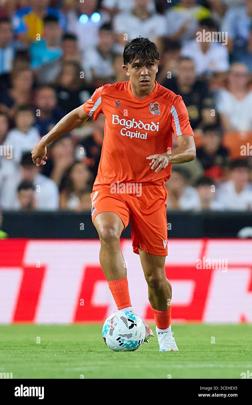 VALENCIA, SPAIN - AUGUST 16: Jon Aramburu of Real Sociedad runs with the ball during to the ...