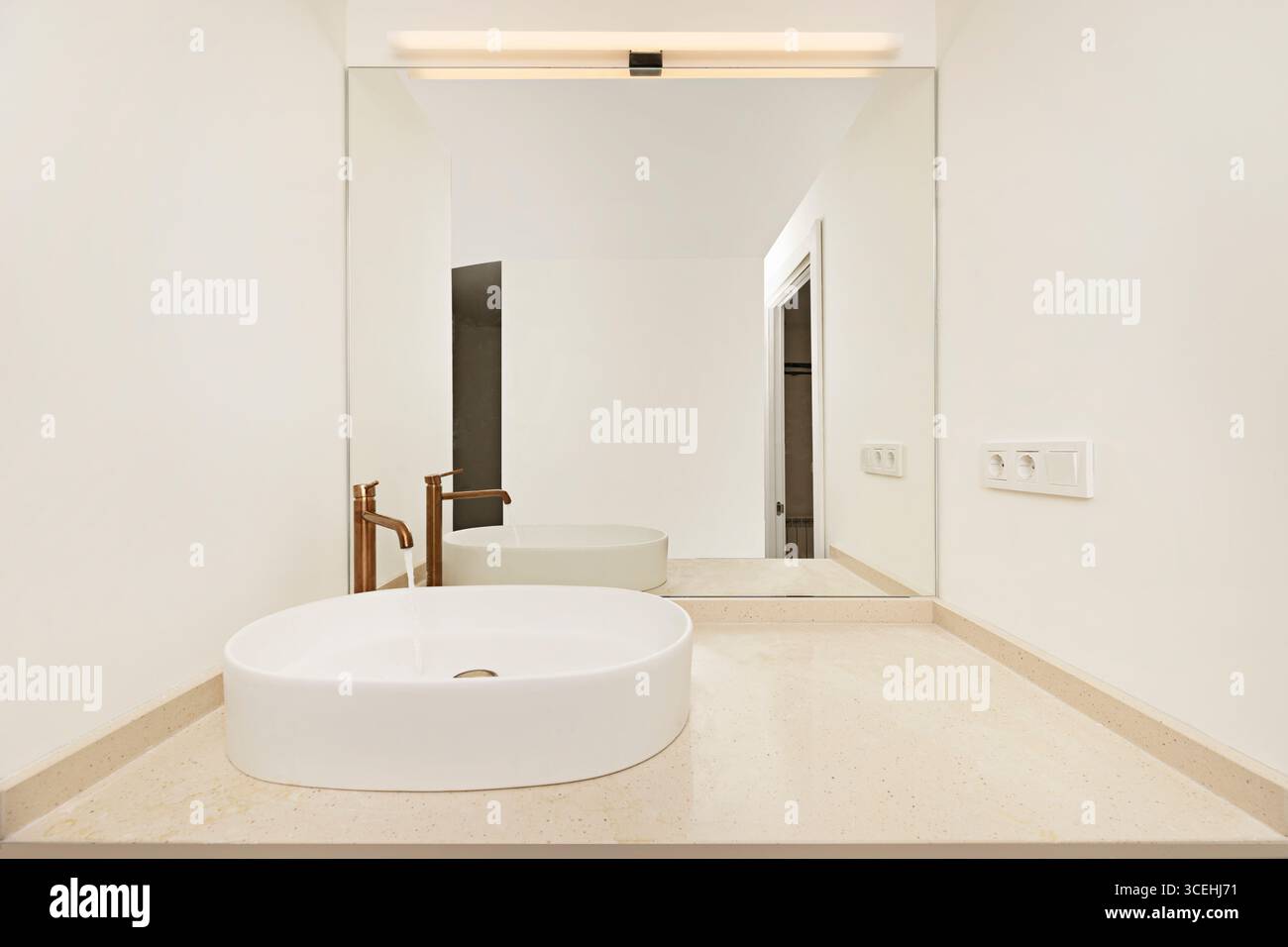 Contemporary bathroom ambiance with a porcelain sink Rectangular ...