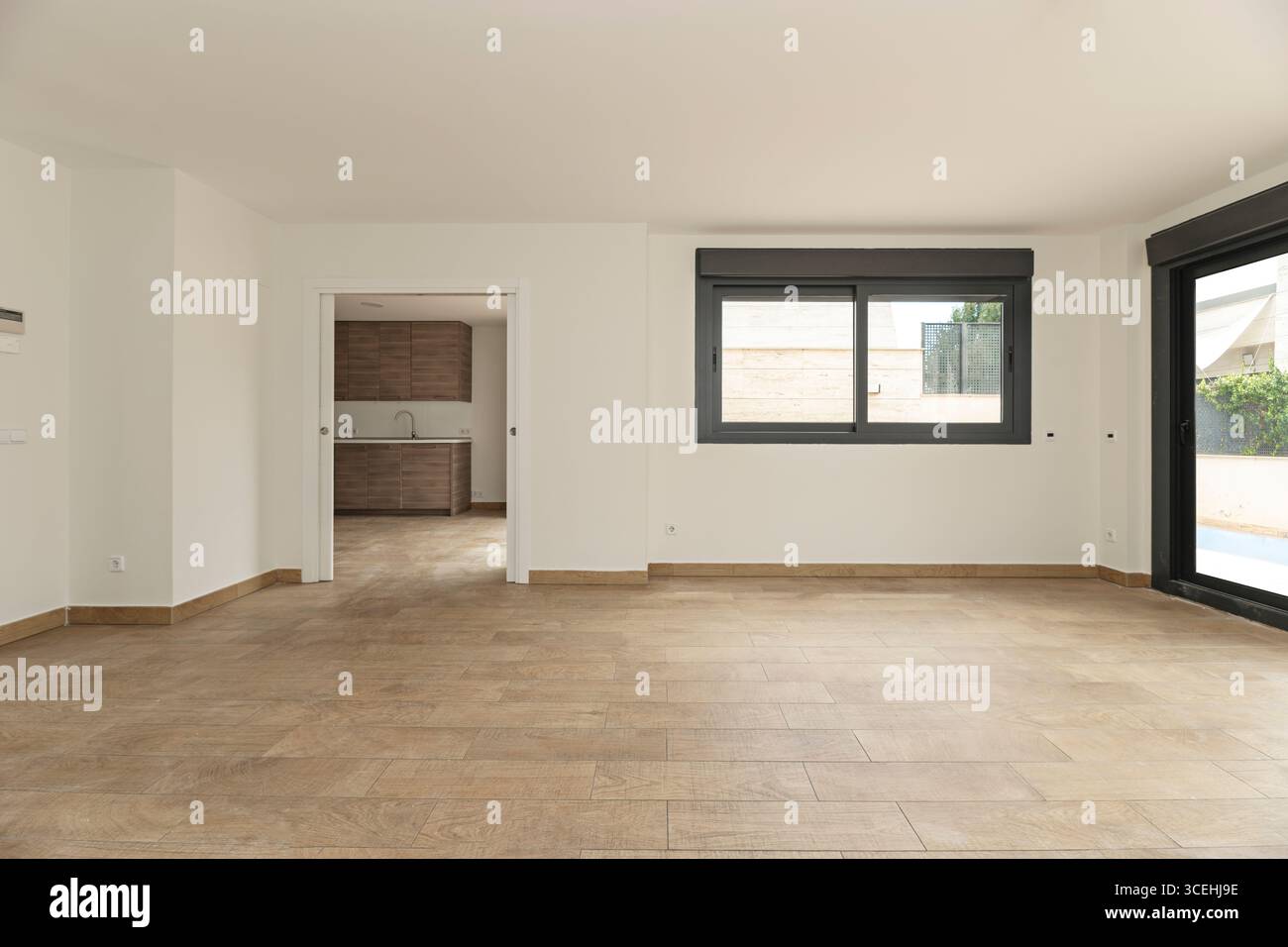 Open-plan reception space with curved windows, recessed ceiling ...