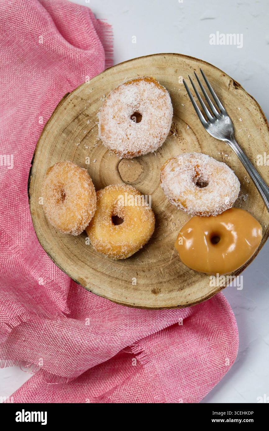 round, ring-shaped donut. The donut has a golden-brown, textured ...