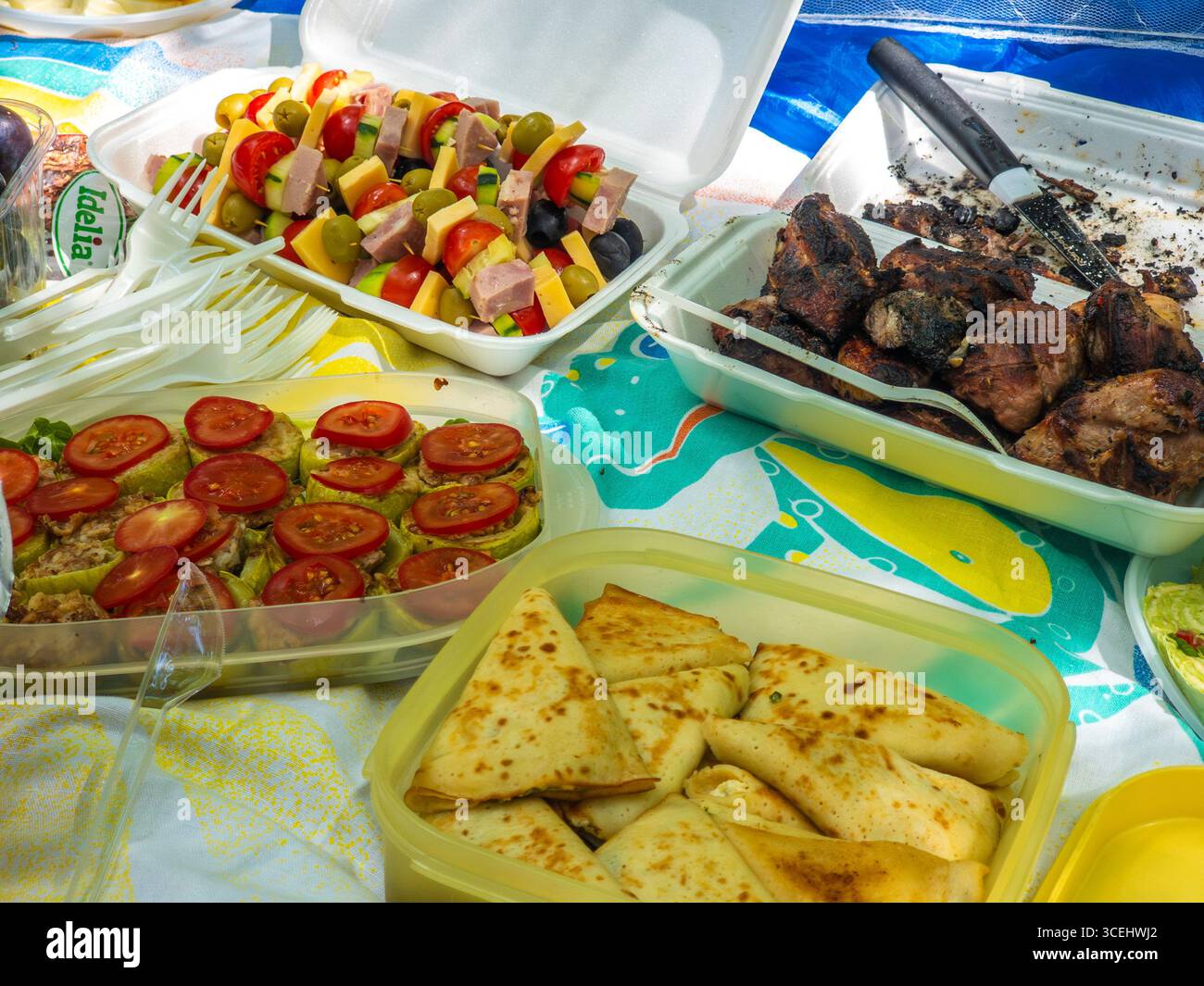 Plastic containers with grilled meat, zucchini and tomato appetizers ...