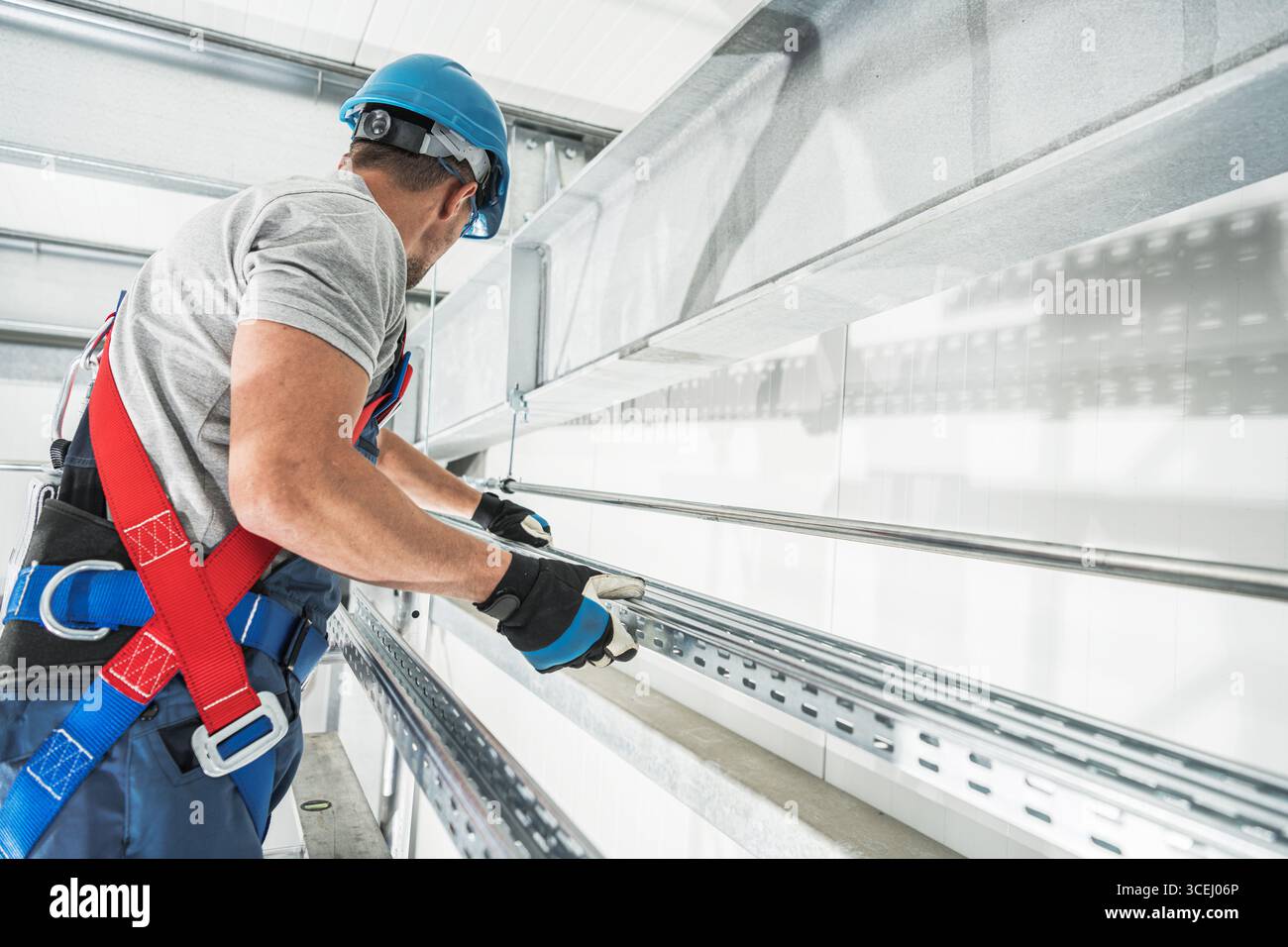 Worker hands carefully installing hi-res stock photography and images ...