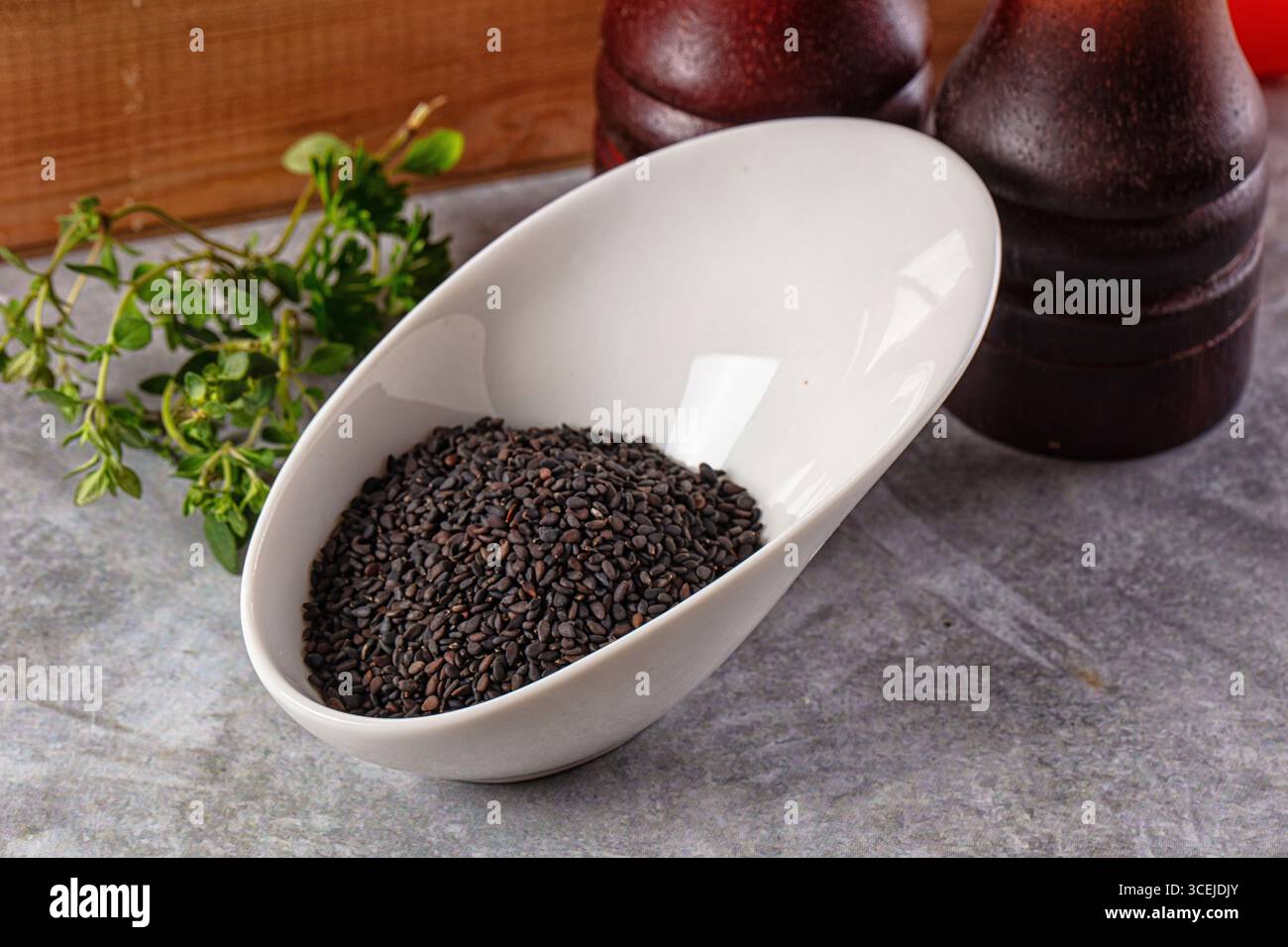 Black raw dry sesame seeds pile Stock Photo - Alamy