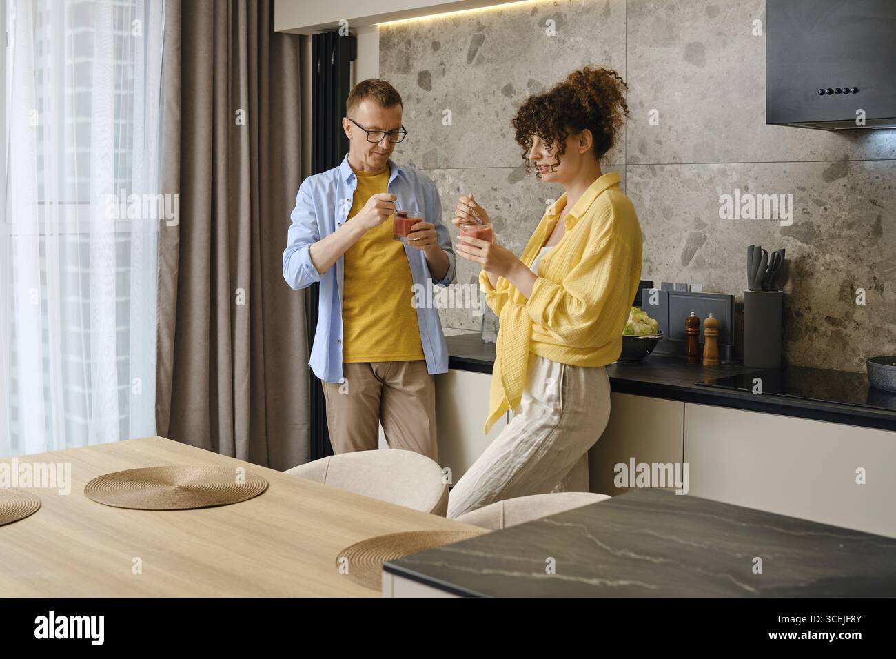 Stylish couple stands together hi-res stock photography and images - Alamy