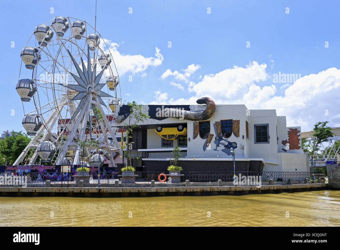 Ferris Whell of the Theme Park along the Malacca or Melaka river ...