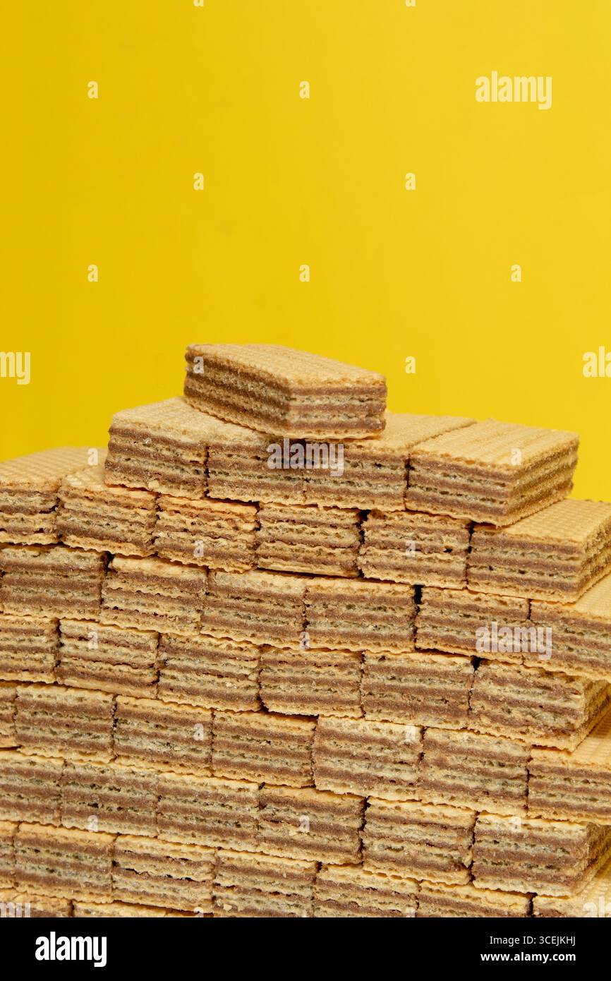 Waffle wall with yellow background Stock Photo - Alamy