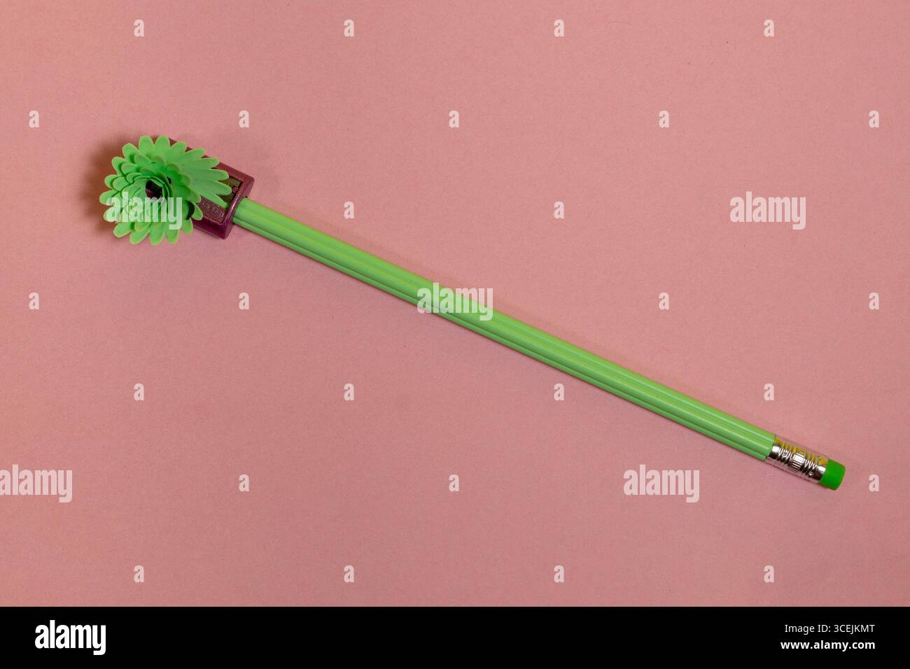 Pastel green graphite pencils of pastel pink surface. Back to school ...