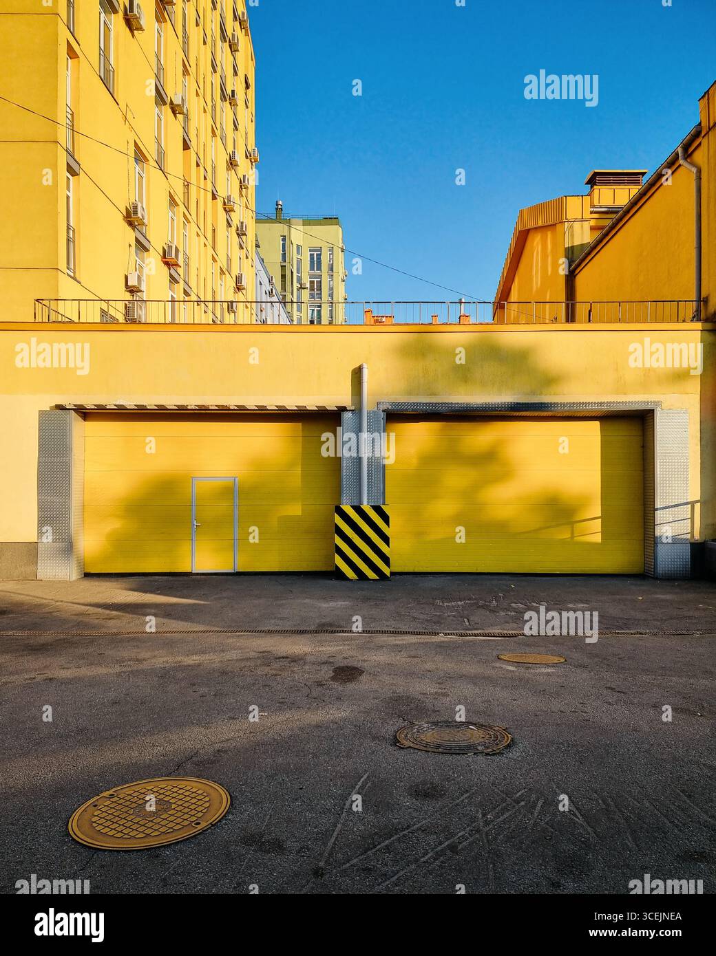 City block with yellow buildings. City street with modern bright ...
