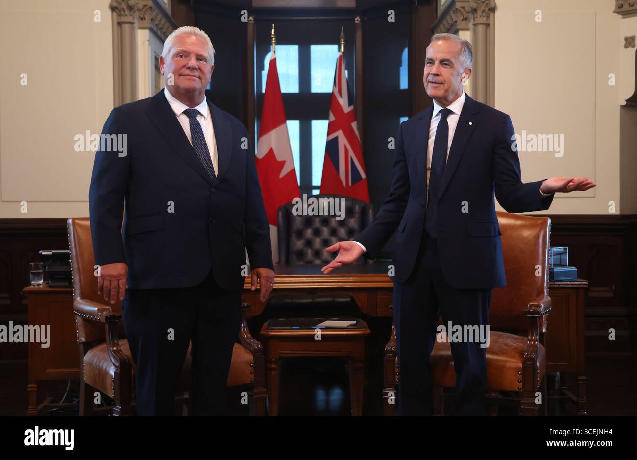 Ontario Premier Doug Ford, left, meets with Prime Minister Mark Carney ...