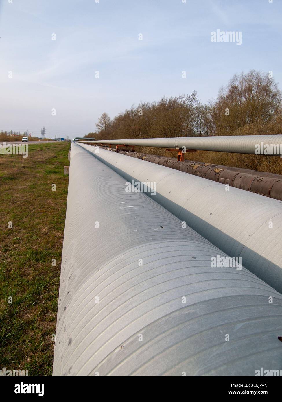 Industrial pipeline running through countryside landscape ...