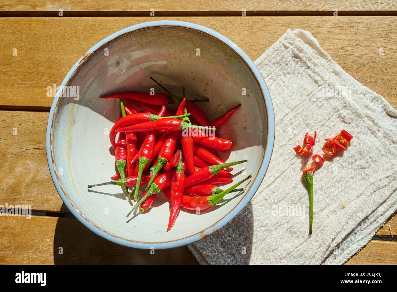 12 August 2025, Brandenburg, Königs Wusterhausen: Red chili peppers lie ...