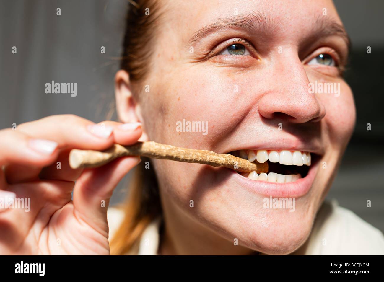 Radiant Smile with Traditional Miswak Stock Photo - Alamy