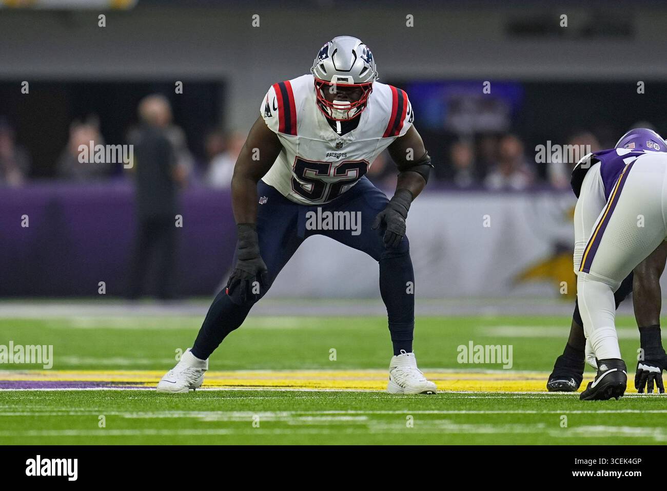 New England Patriots offensive tackle Marcus Bryant (52) lines up for ...