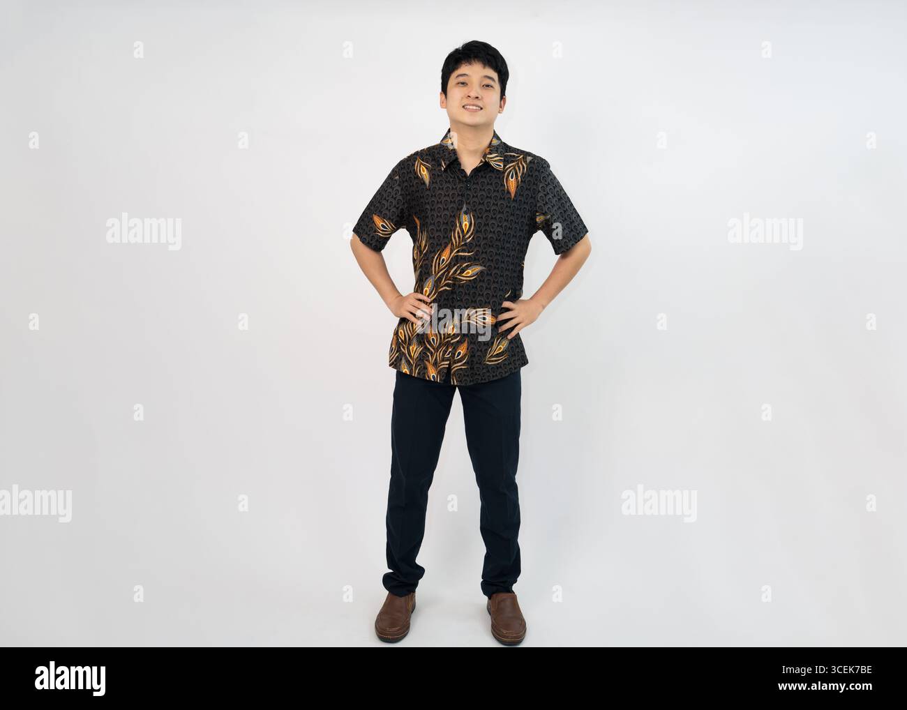 Smiling man standing comfortably hi-res stock photography and images ...