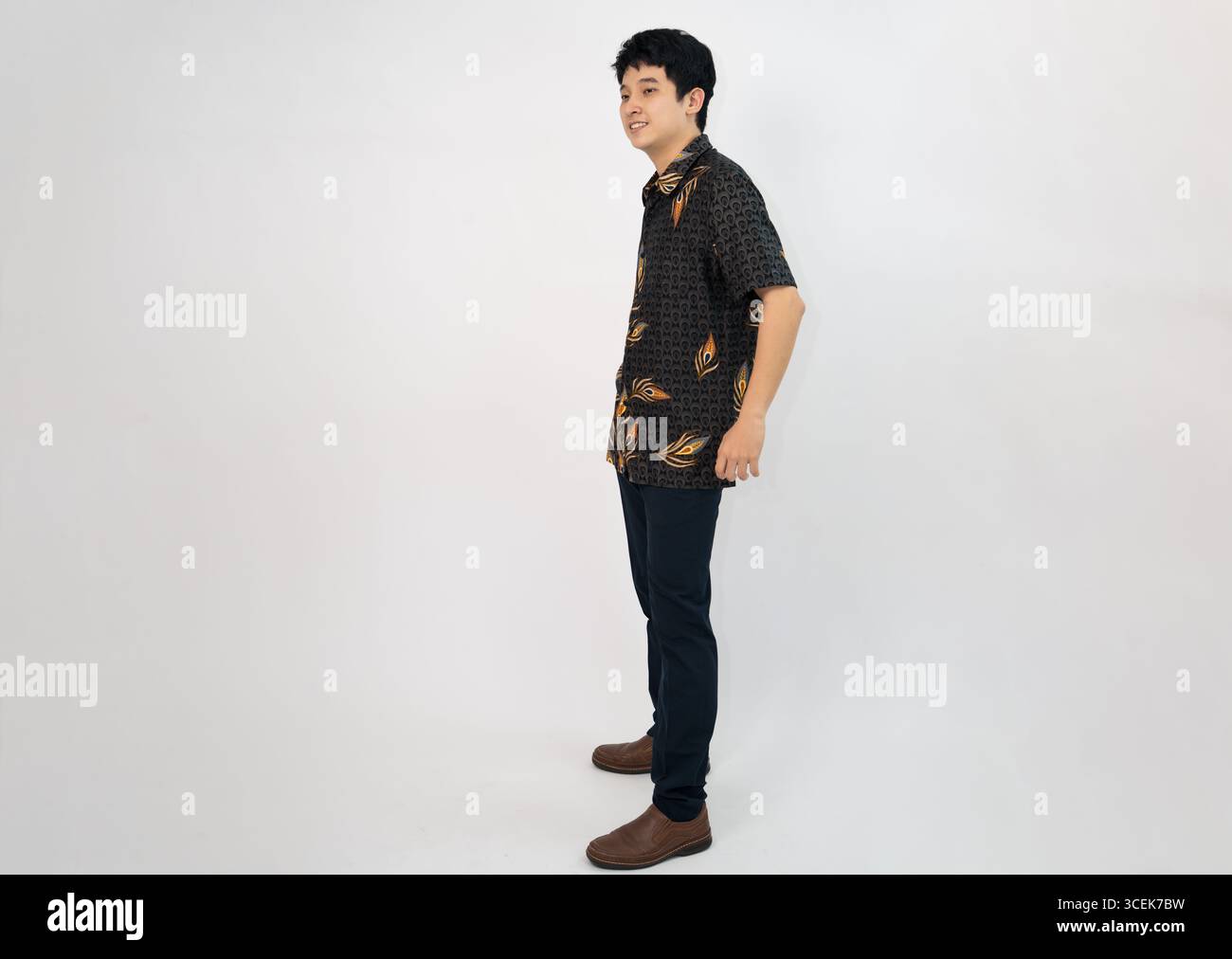 Smiling man standing comfortably hi-res stock photography and images ...