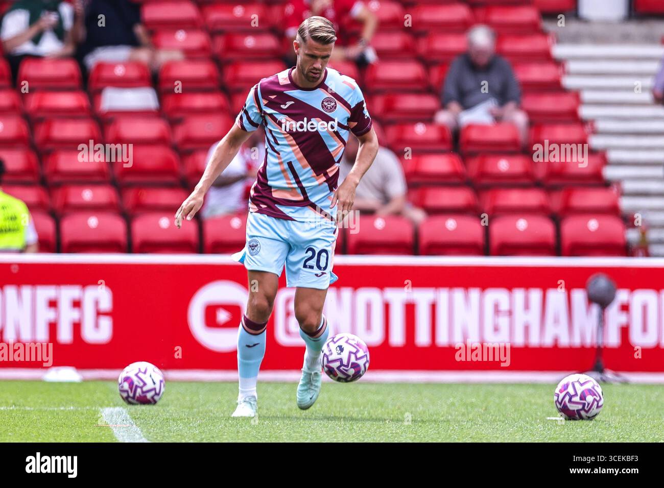 Kristoffer Ajer of Brentford warms up before the Nottingham Forest FC v ...