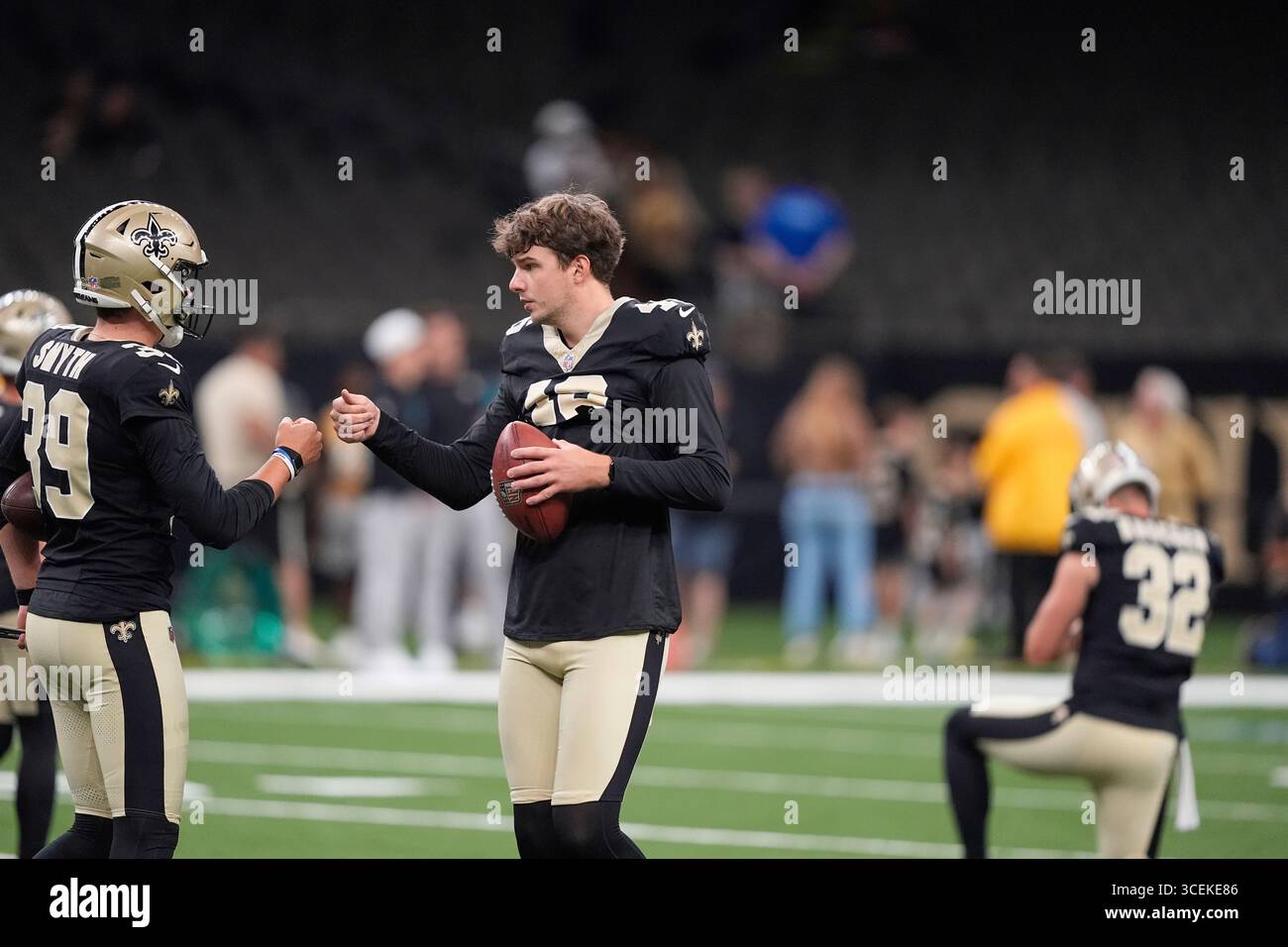 New Orleans Saints place kicker Charlie Smyth (39) warms up with punter ...