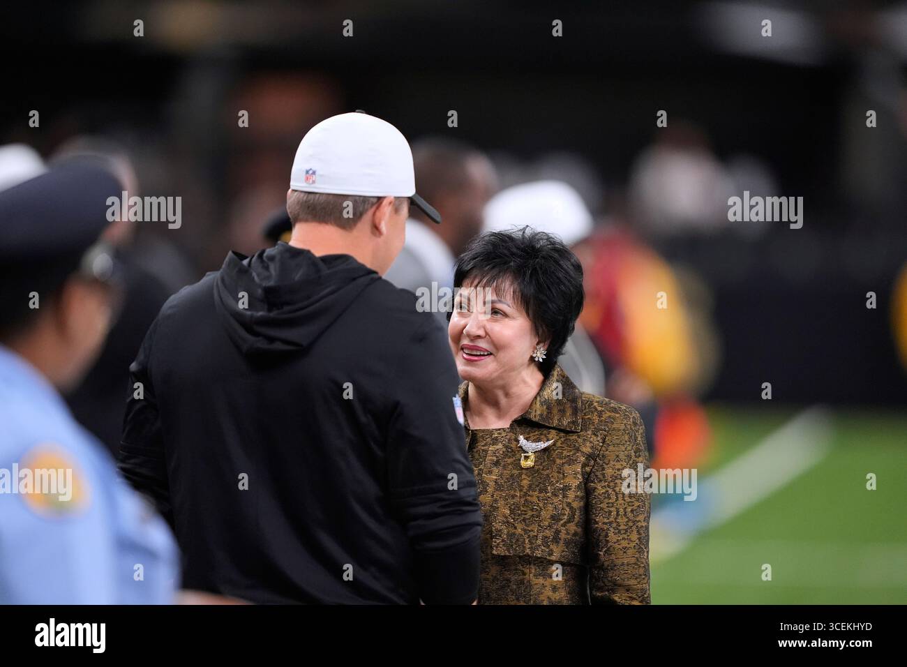 New Orleans Saints head coach Kellen Moore talks with team owner Gayle ...