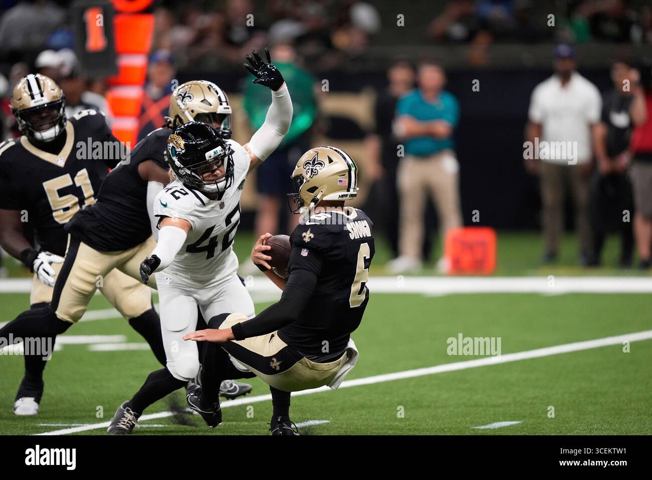 New Orleans Saints quarterback Tyler Shough (6) is sacked by ...