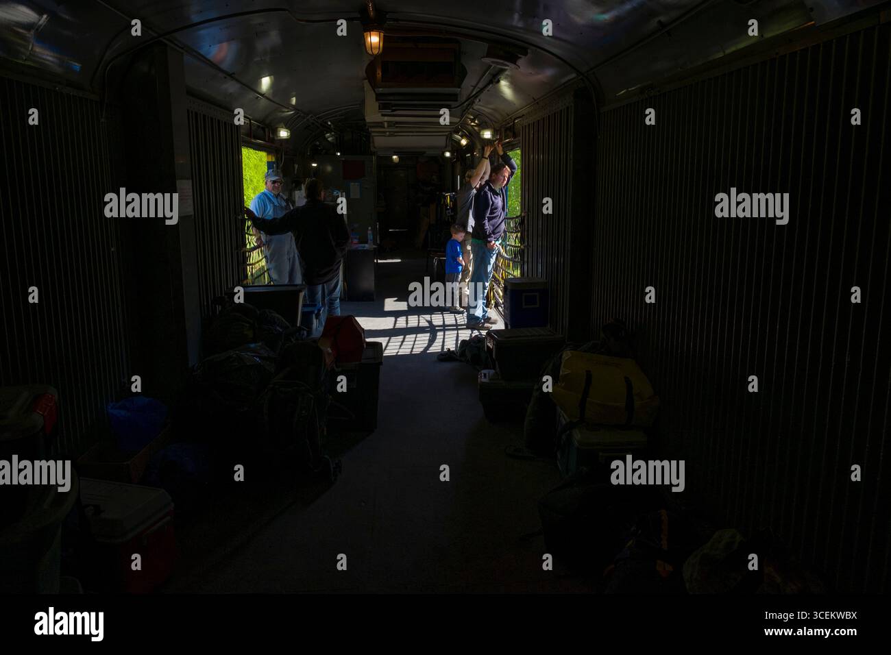 People standing in luggage car aboard the Alaska Railroad Hurricane ...