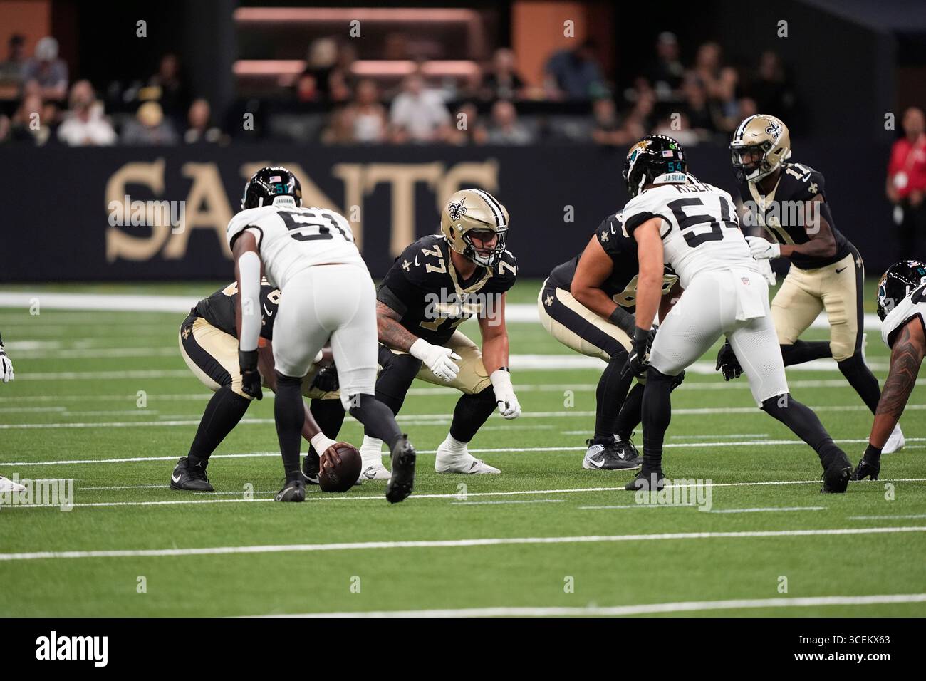 New Orleans Saints offensive tackle Dillon Radunz (77) lines up for a play in the first half of ...