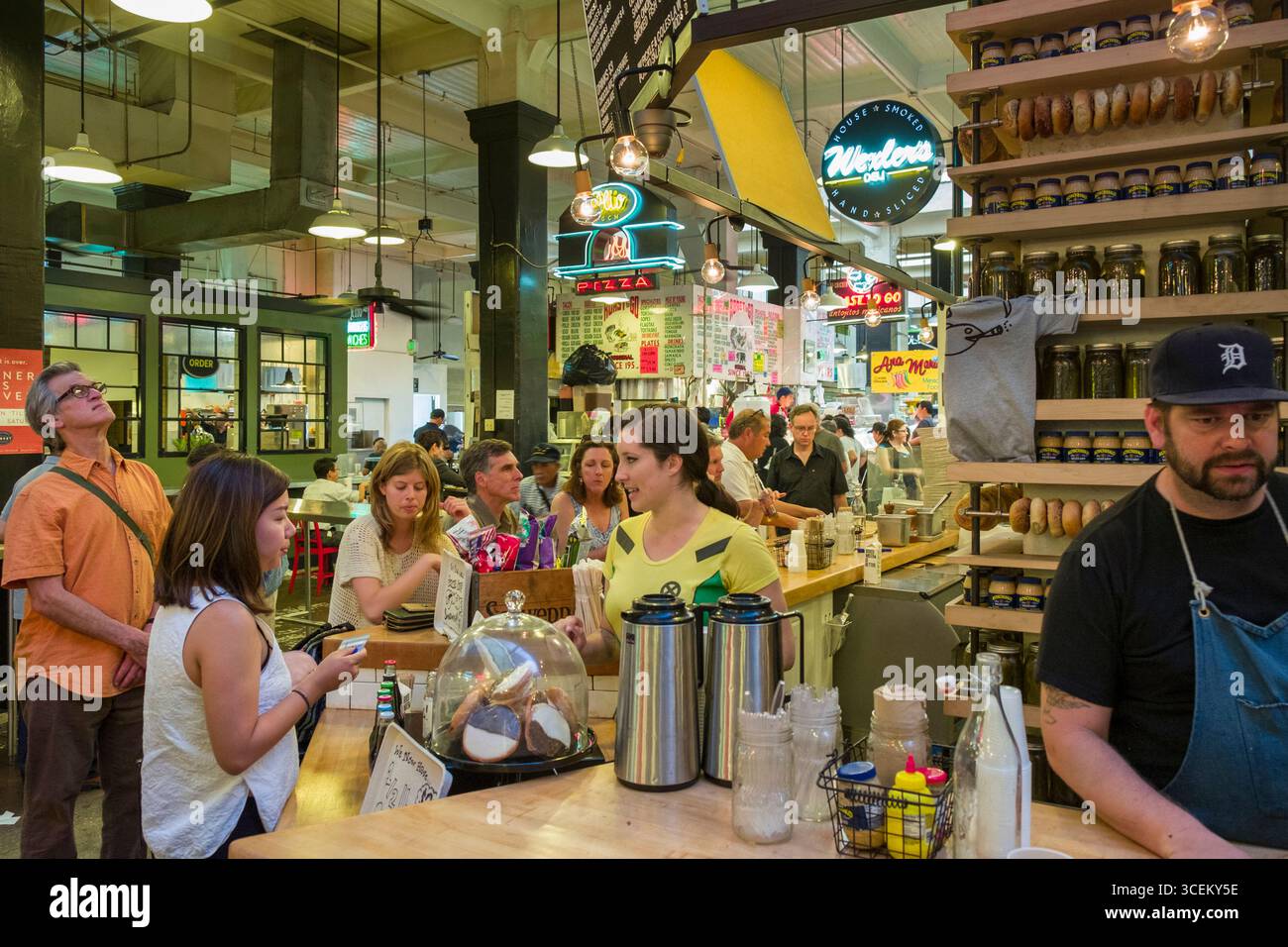 People at counter of walk-up café inside the Grand Central Market, Los ...