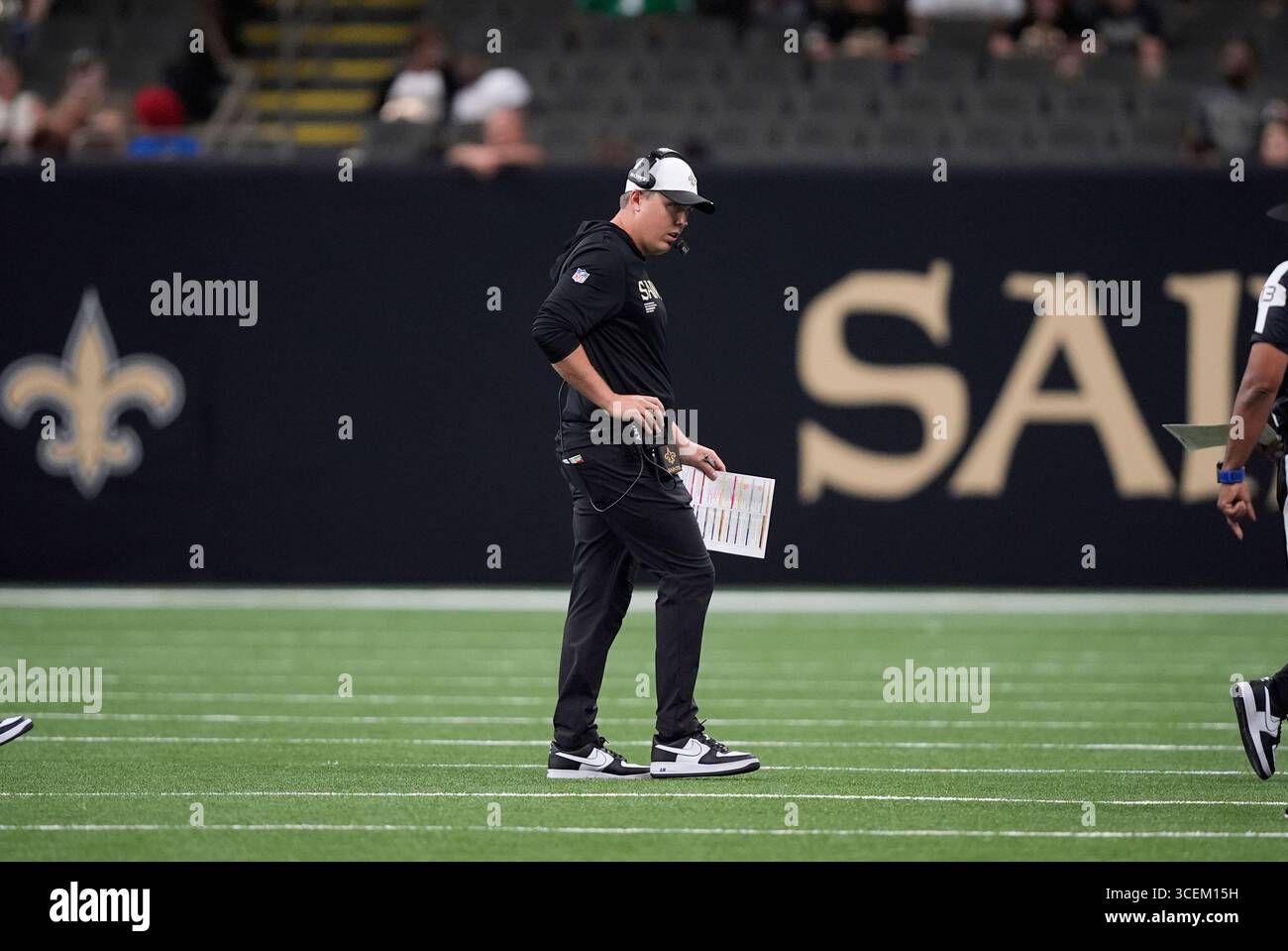 New Orleans Saints head coach Kellen Moore walks on the field in the ...