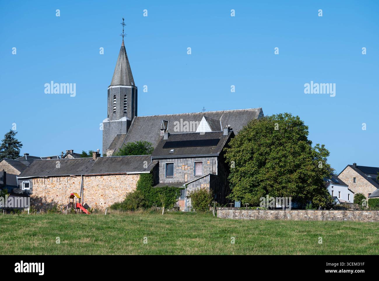 The catholic church and green surroundings of the village of ...