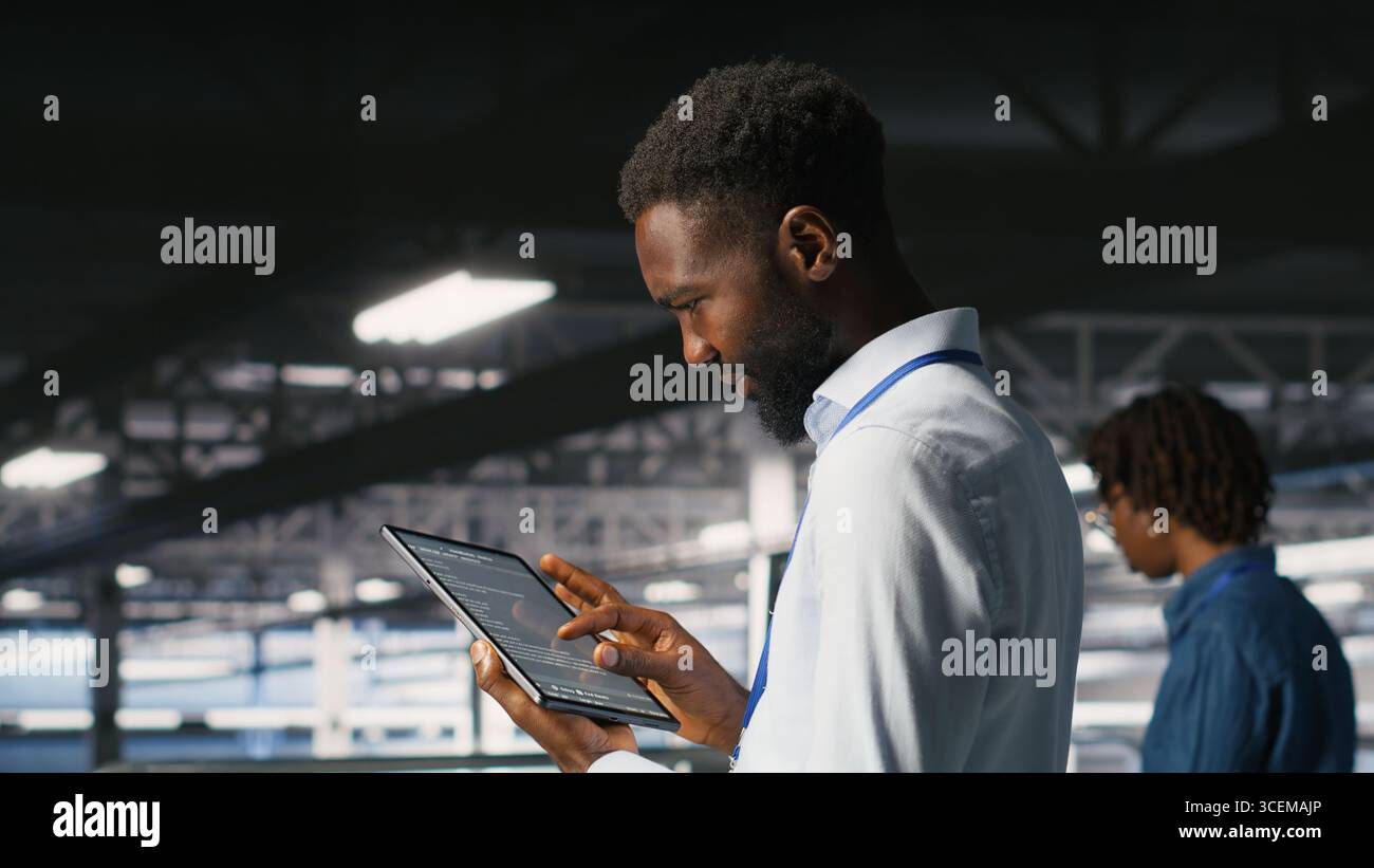 Data center programmer checking lines of code and colleague reviewing ...