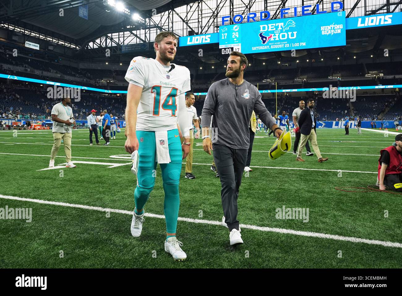 Miami Dolphins quarterback Quinn Ewers, left, walks off the field after ...