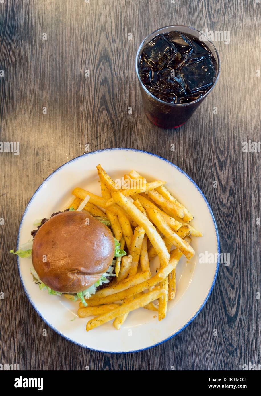 Top-down view of traditional American cheeseburger lunch adorned with ...