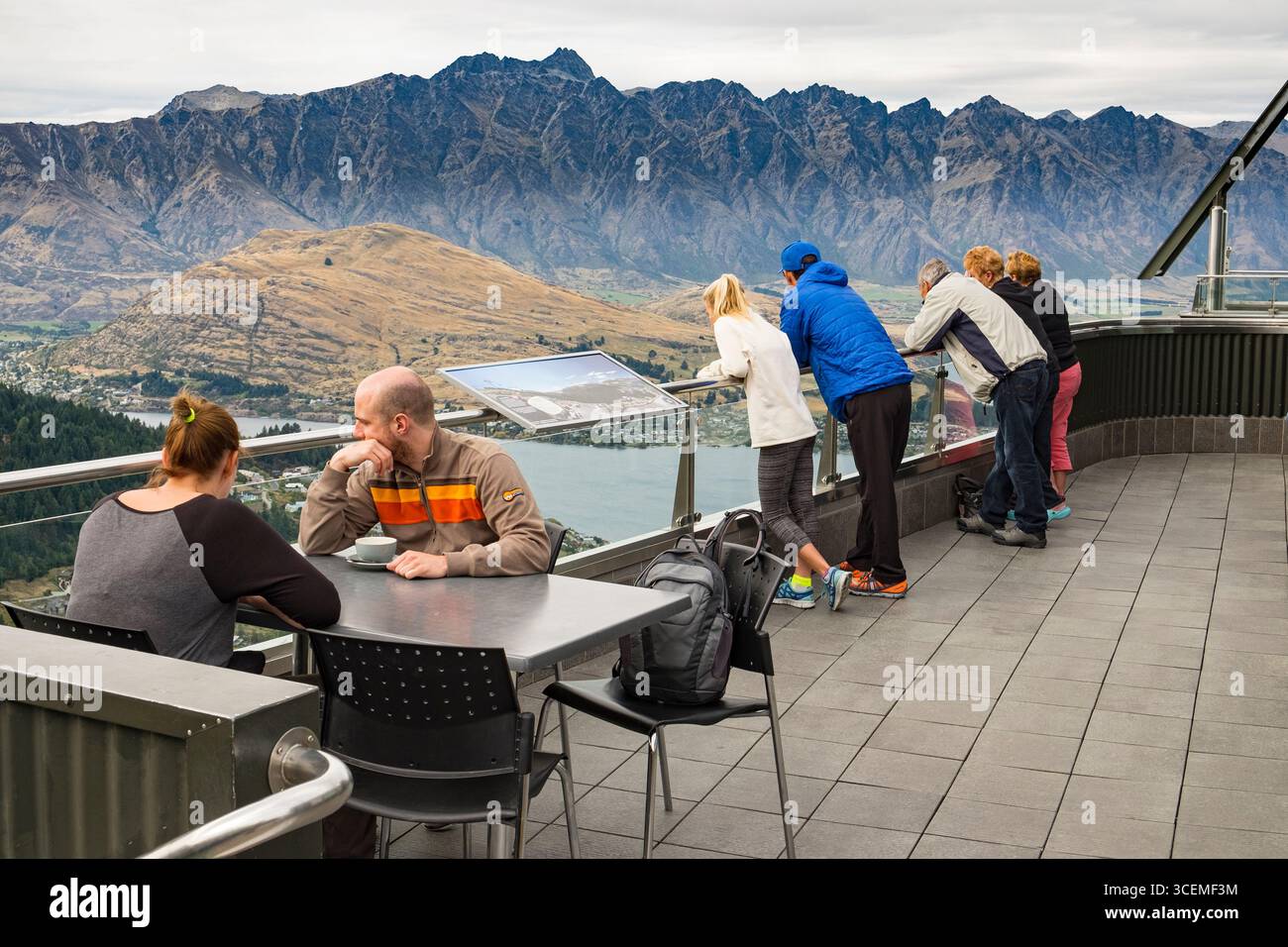 People looking at view of Queenstown from the observation deck at the ...