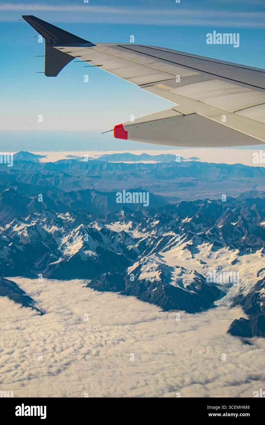Wing of an Airbus A320 jet aircraft above New Zealand snow covered ...