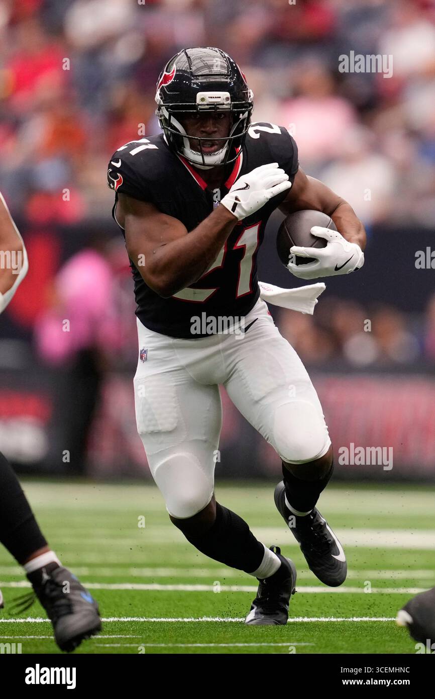 Houston Texans running back Woody Marks (27) runs the ball during an ...