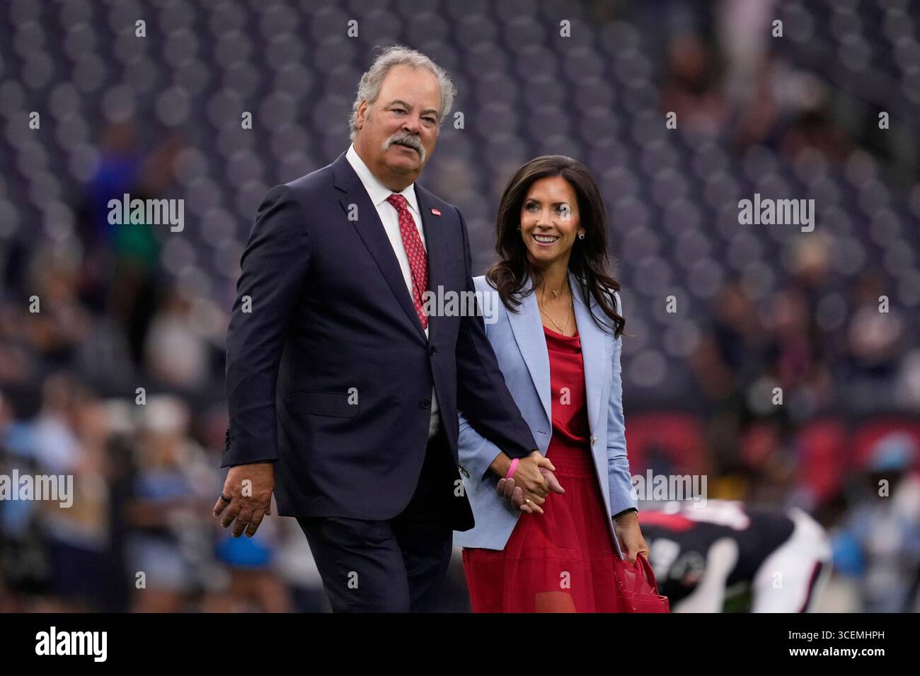 Houston Texans owner Cal McNair and his wife, Hannah McNair, walk on ...