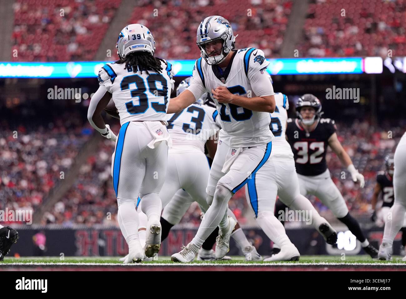 Carolina Panthers quarterback Jack Plummer (16) hands off to running ...
