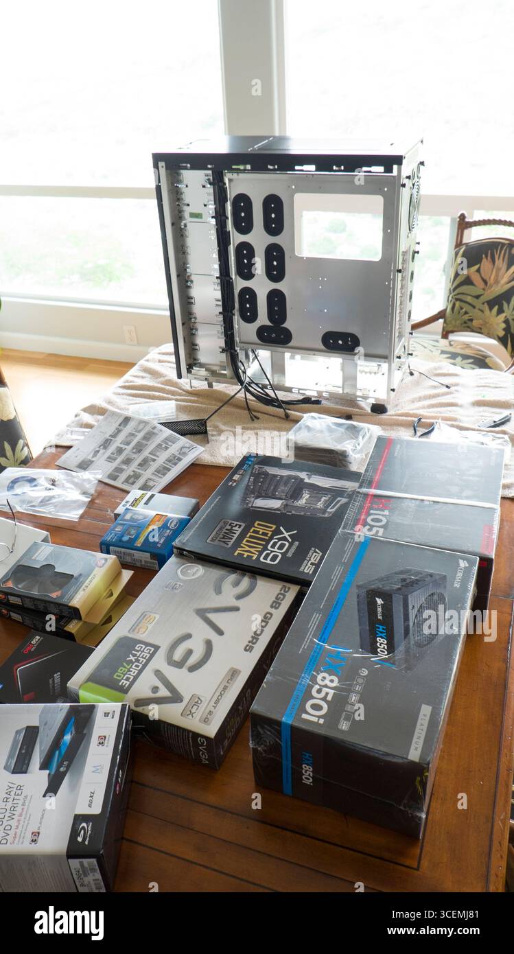 Boxes of new computer components and an empty Lian Li A79 aluminum ...