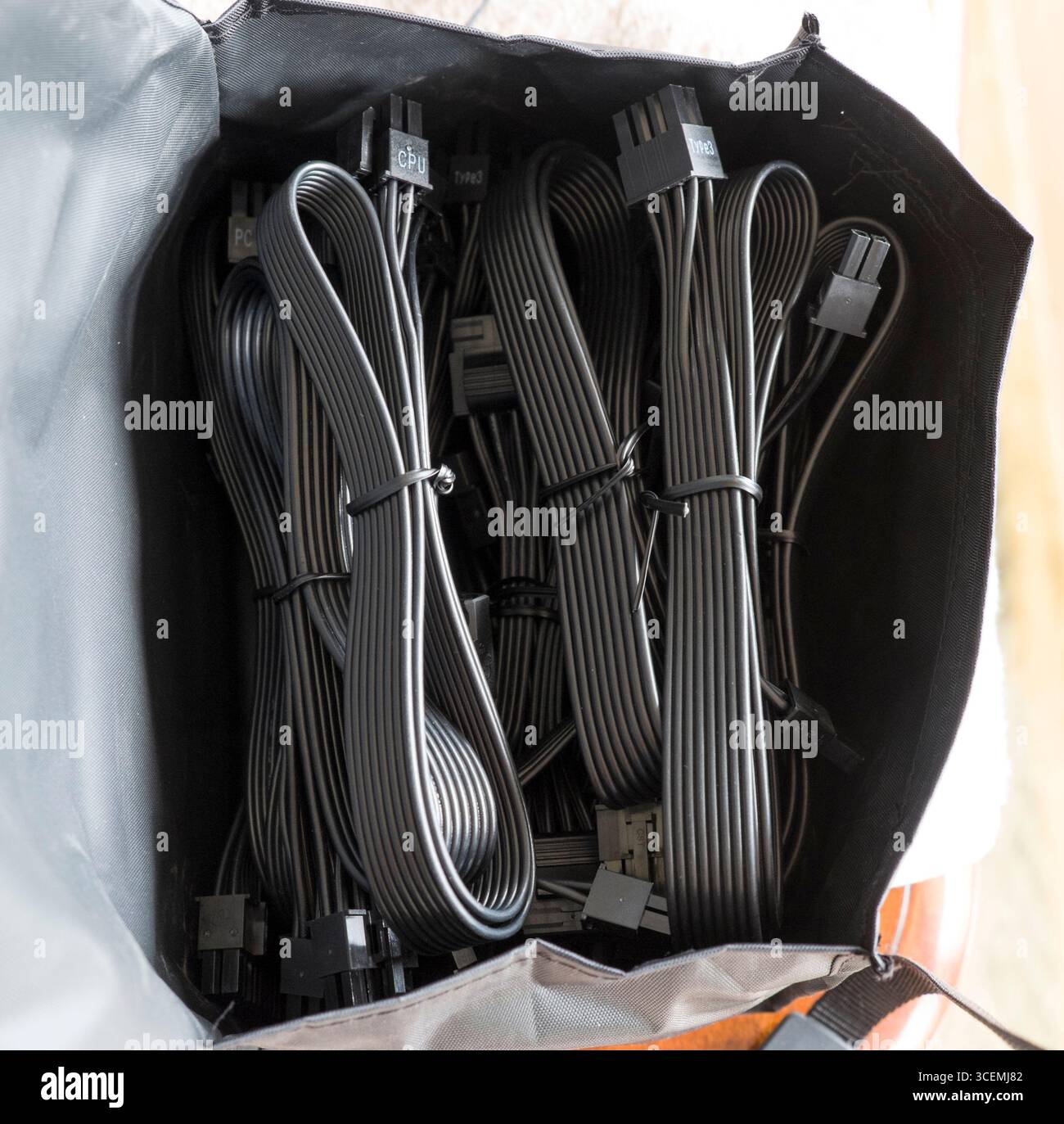 Bag full of power cords that connect the computer power supply to the ...