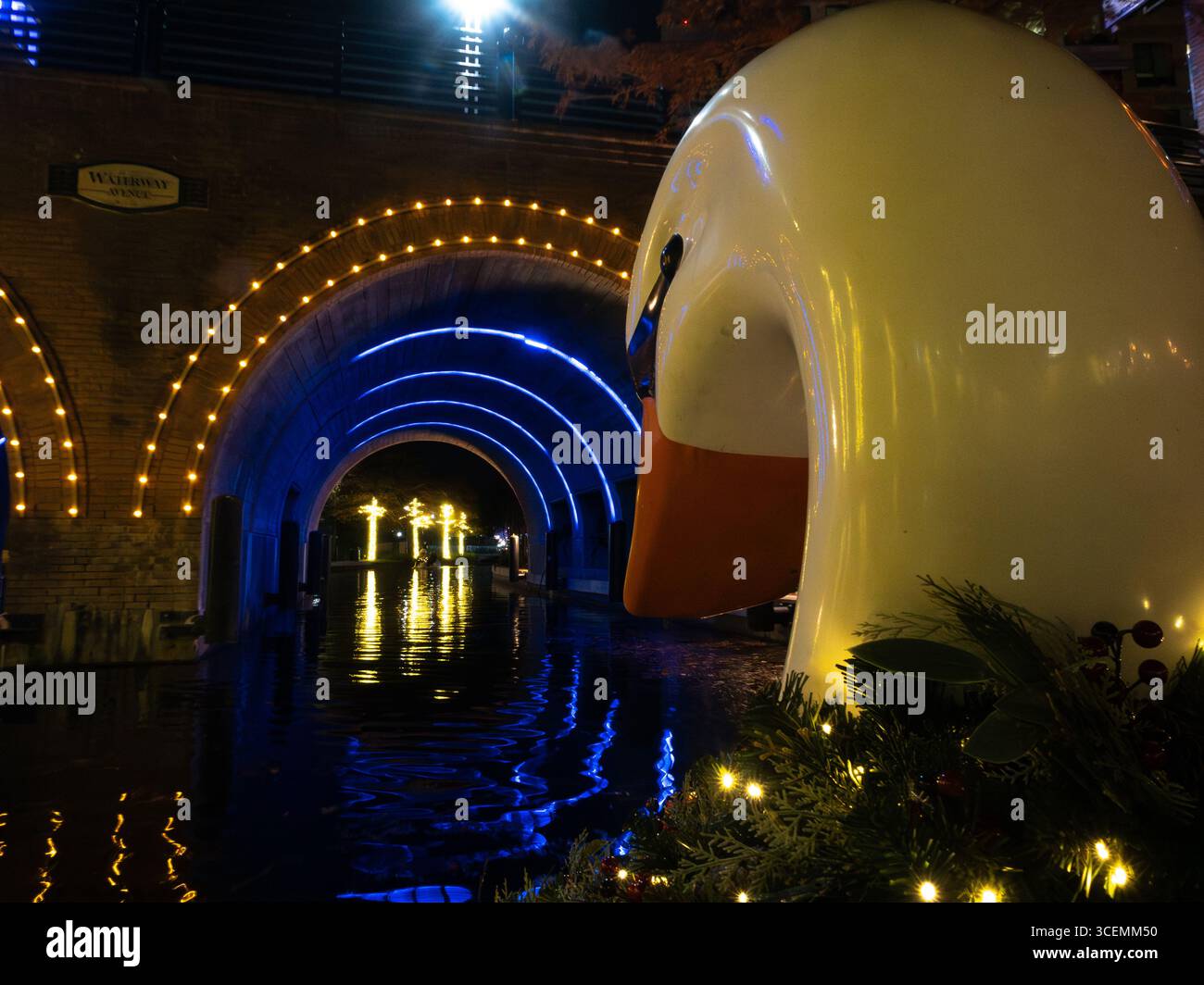 The Waterway Avenue bridge with gold and blue lights in its arches ...