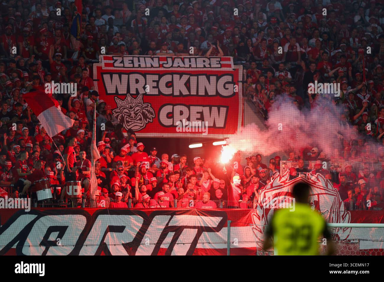 Essen fans set off Bengal fires in the fan block during a German Cup ...